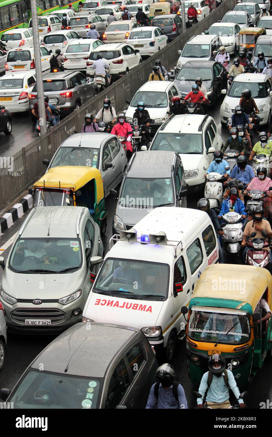 An ambulance stuck amid heavy traffic congestion caused after a heavy ...