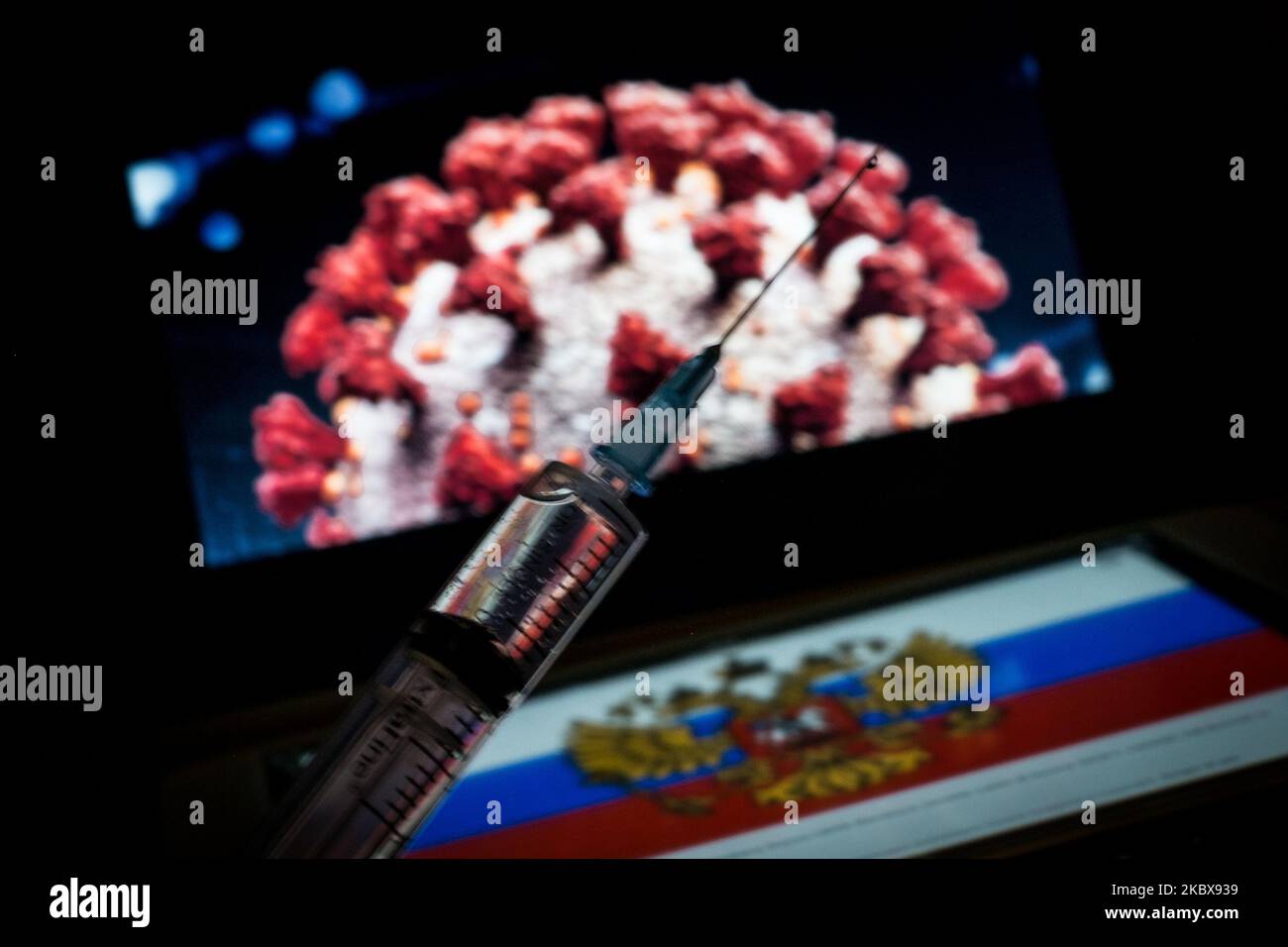 Photo illustration of the medical syringe is seen with the Russian flag ...
