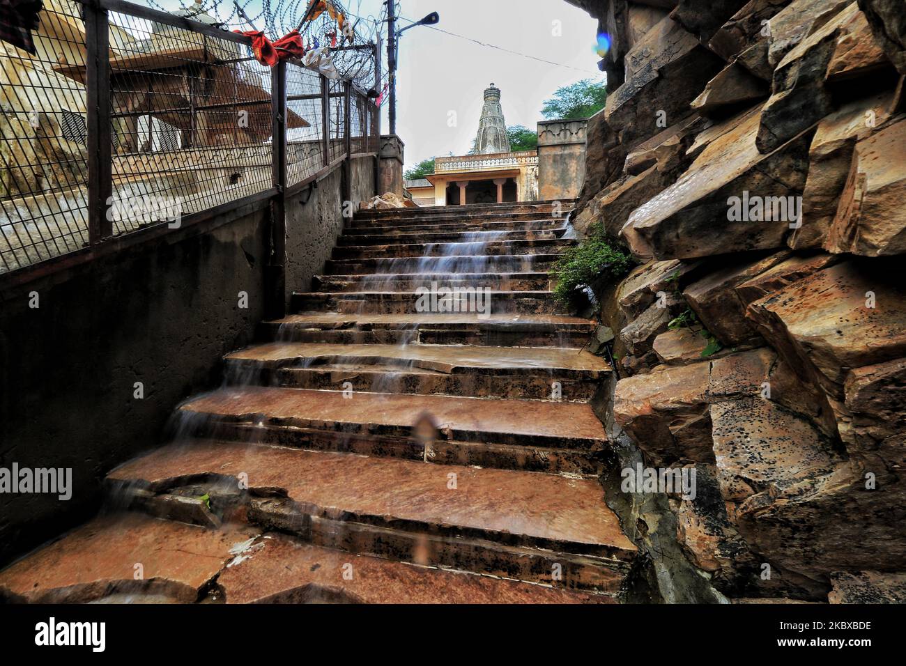 Water flowing down the stairs at Galta Ji temple following heavy ...