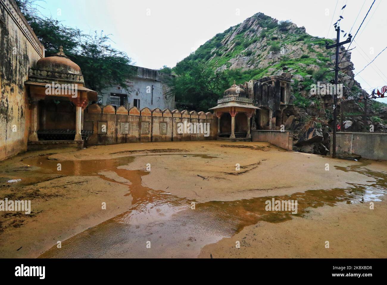 A view of submerged holy kund ( Shrine Pond) of Galta ji Temple in mud ...