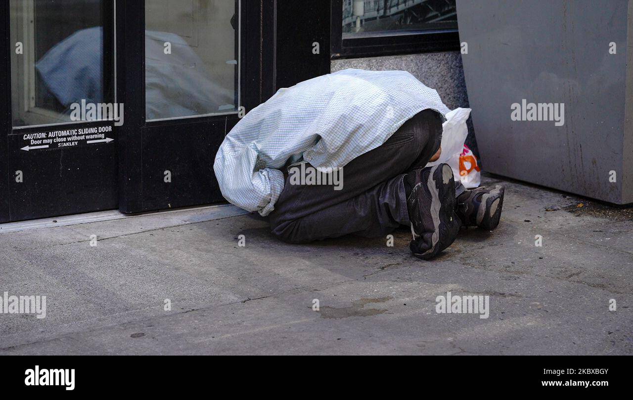 A couple of men nod out on the street from heroin high onNew York City ...