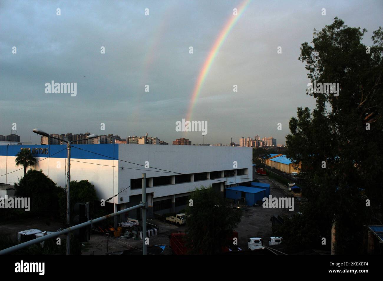 A rainbow is seen after a spell of light rain, at Anand Vihar ISBT, on ...