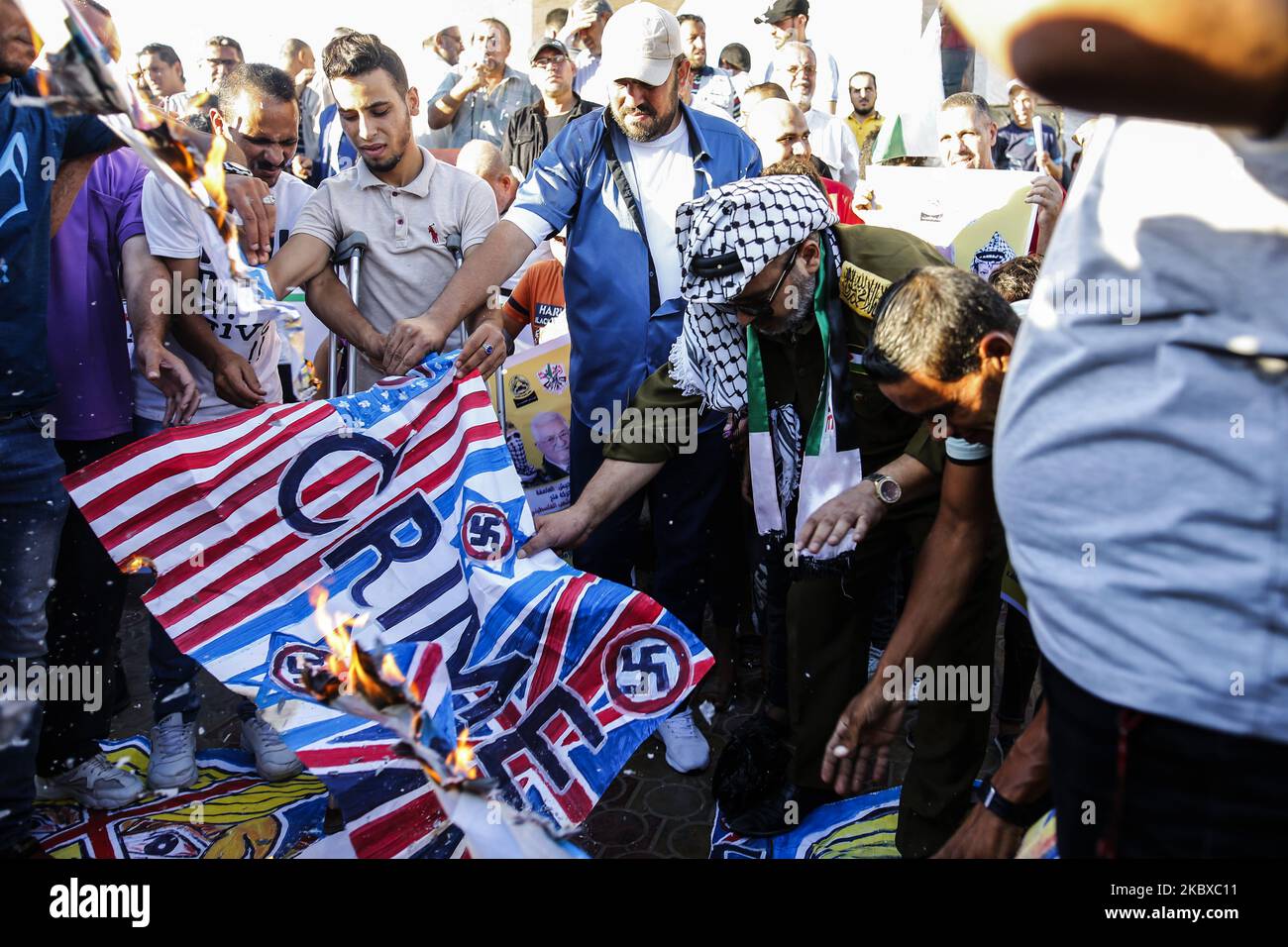Palestinians during a protest against the United Arab Emirates' deal ...