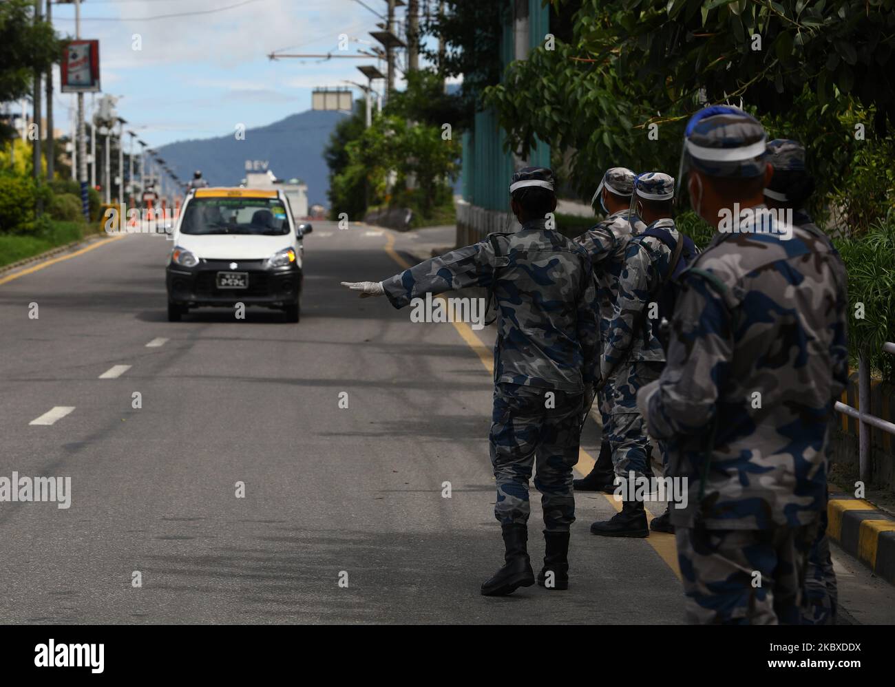Nepalese Armed Police Force (APF) on duty wearing face shield stands on ...