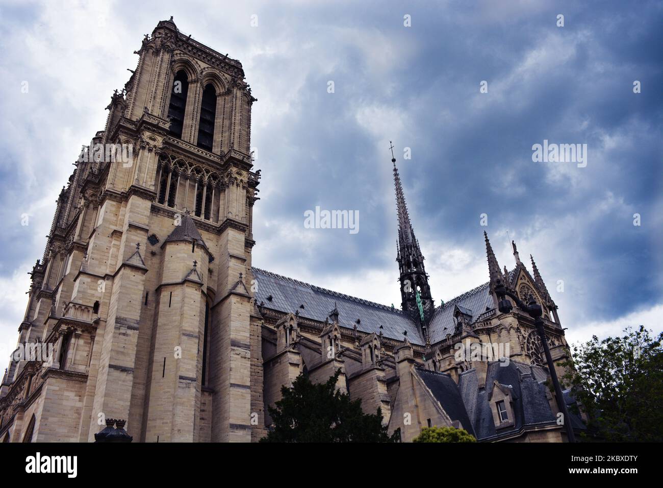 A low angle shot of the Notre Dame Cathedral of Paris under dramaric ...