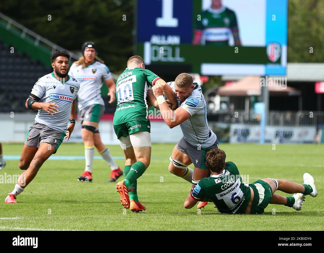 Nick Isiekwe of Northampton Saints getting tackled by Jack Cooke of ...