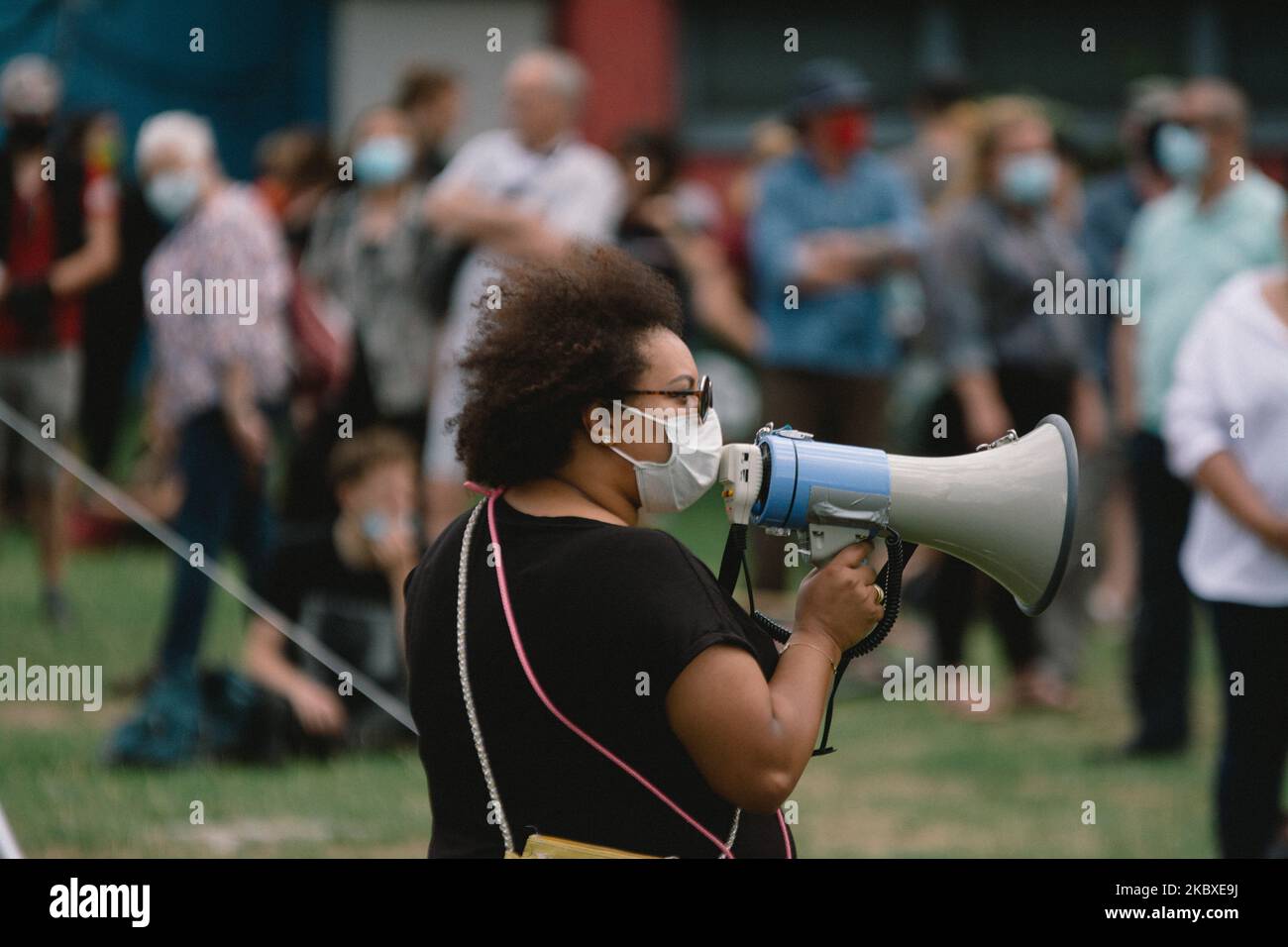 One organizer speaks to the crowd of participaters during the anti ...