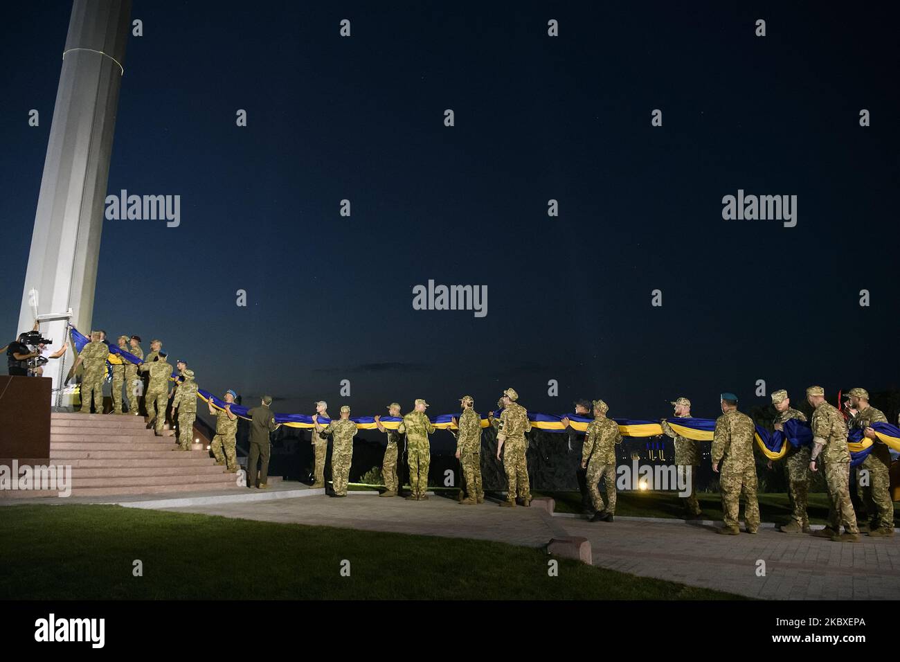 The ceremony of rising the giant state flag of Ukraine the night before ...