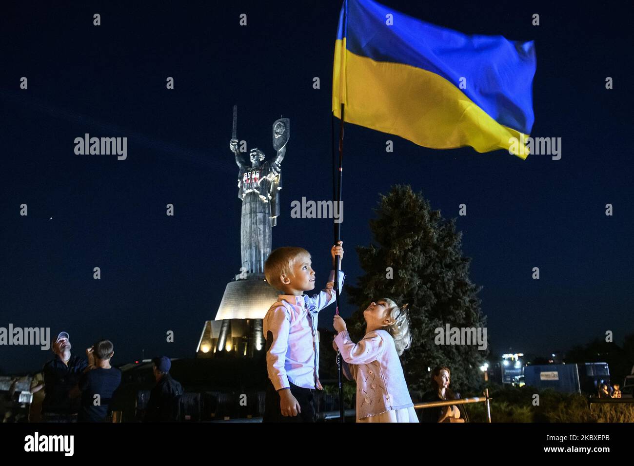 Children wave ukrainian flag during the ceremony of rising the giant ...