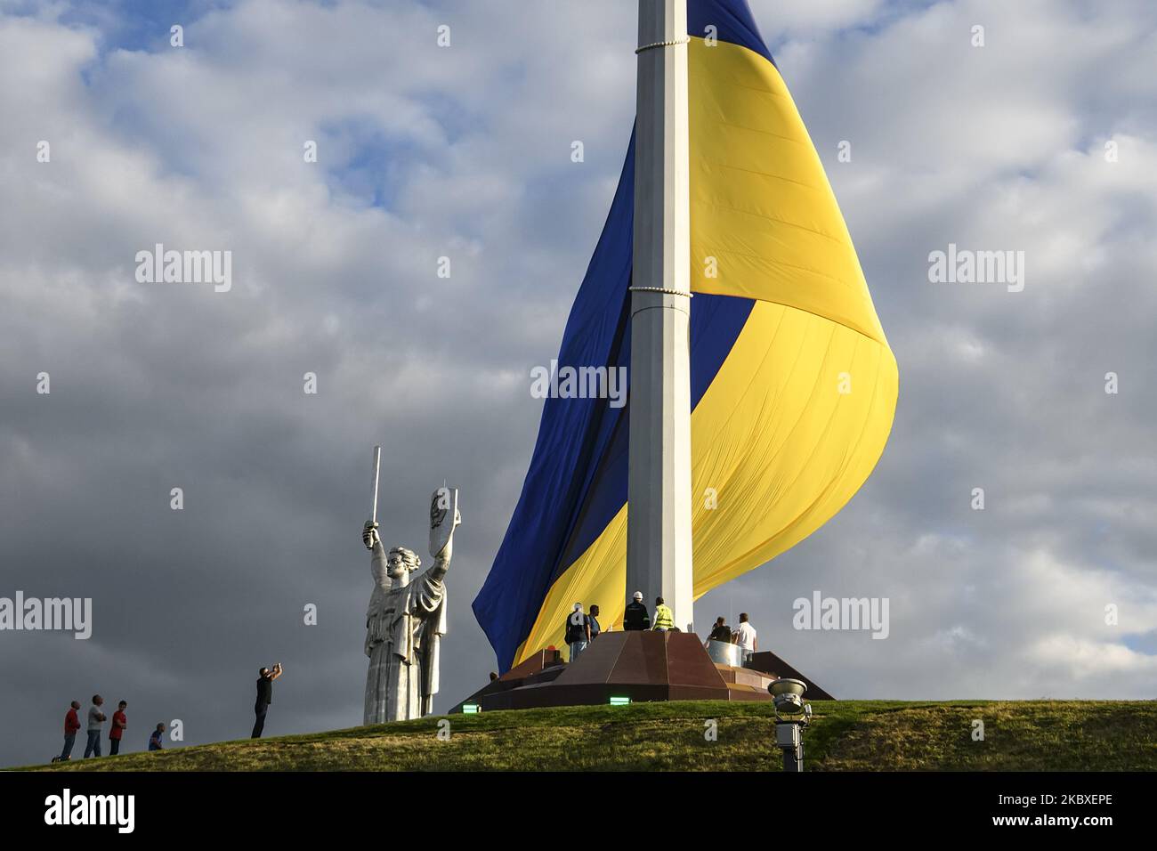 Ukrainians set up the giant state flag of Ukraine the night before the ...