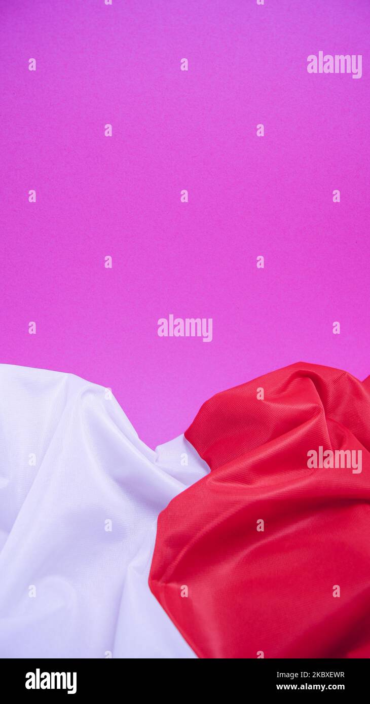 Folded Flag of Poland on Vivid Pink Background Stock Photo - Alamy