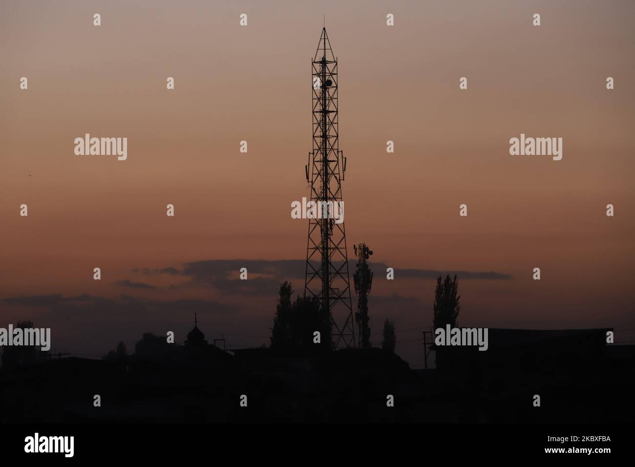 An Mobile Network tower is seen during sunset in Srinagar, jammu and ...