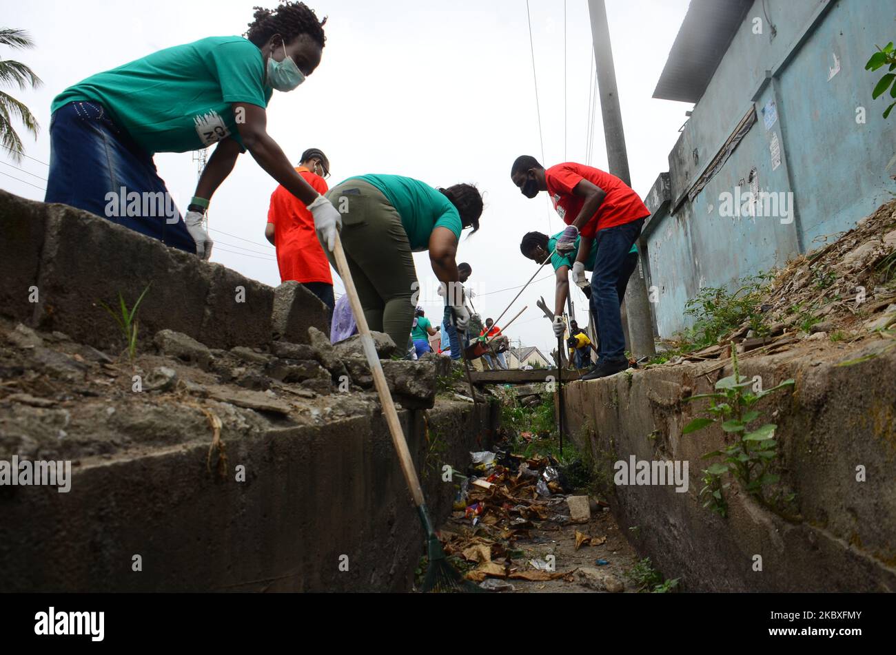 Groups of volunteers picking waste on the road sides and drainages in ...