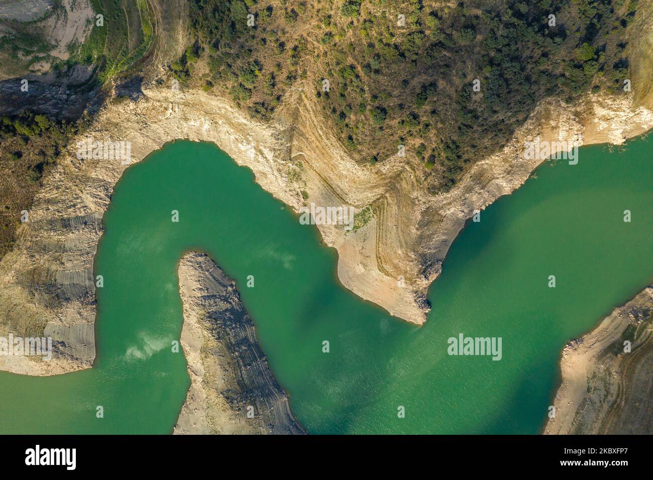 Aerial view of the almost dry Pantà de Siurana reservoir during the ...