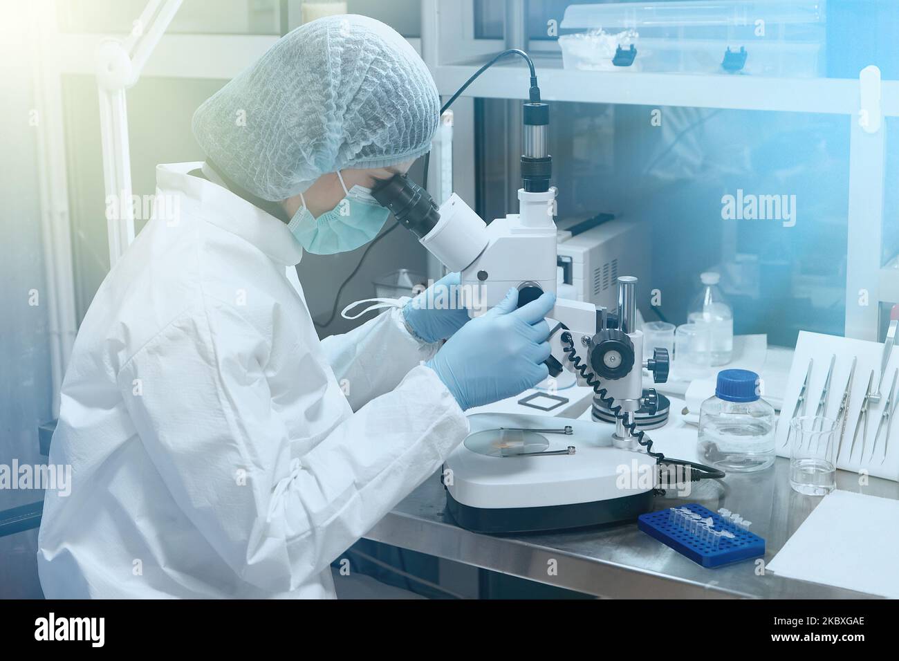 A scientist looking in the microscope hi-res stock photography and ...