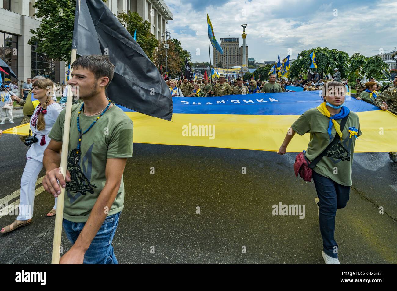 People marching with a huge ukrainian flag during the celebrations of ...