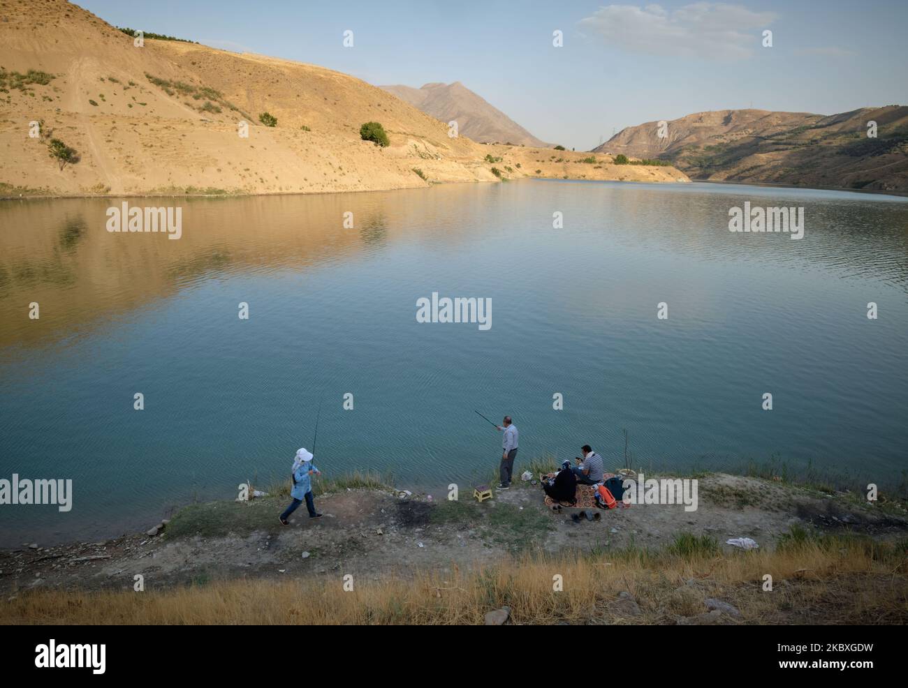 An Iranian family picnic on a shore of a lake in the Lavasan ...