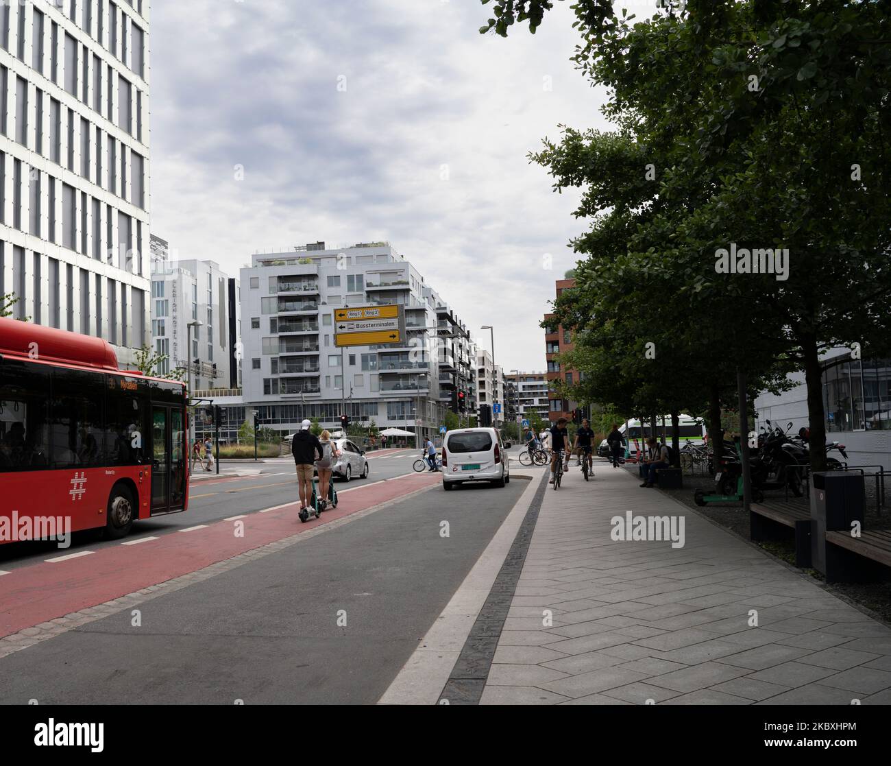 A busy street with people walking and cycling in Oslo, Norway Stock ...