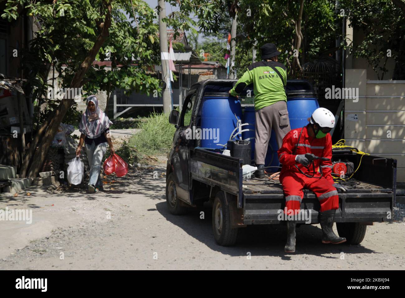 Volunteer of humanitarian organization of Lingkaran Peduli, wearing ...