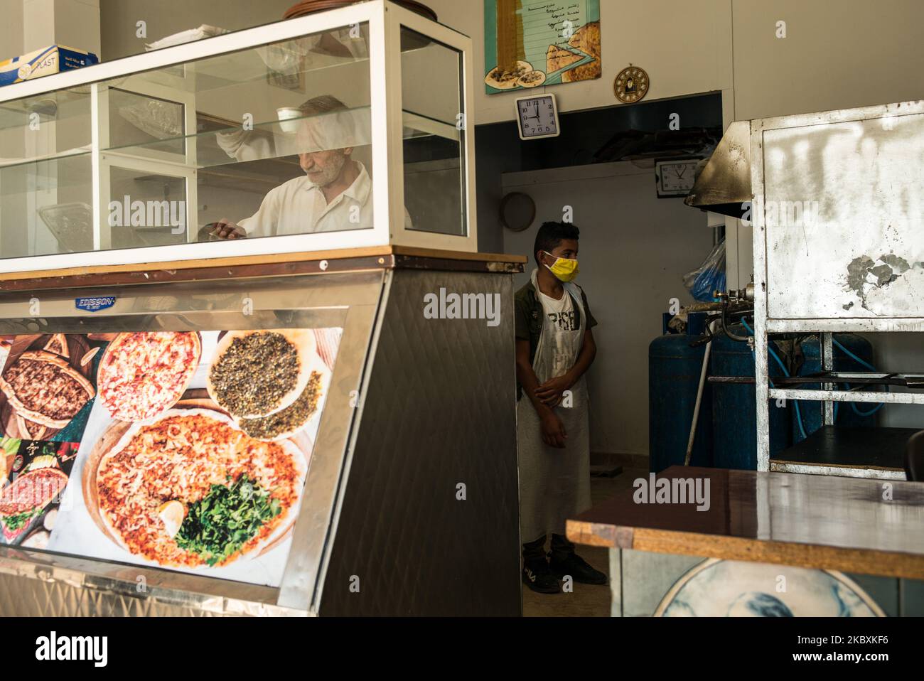 Prepairing the traditional Lebanese food called Manoushe. A flat bread ...