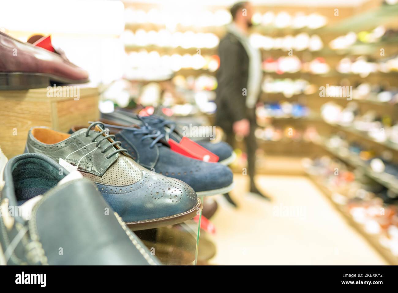 Shelves with different footwear at shoes store - new shoes collection ...