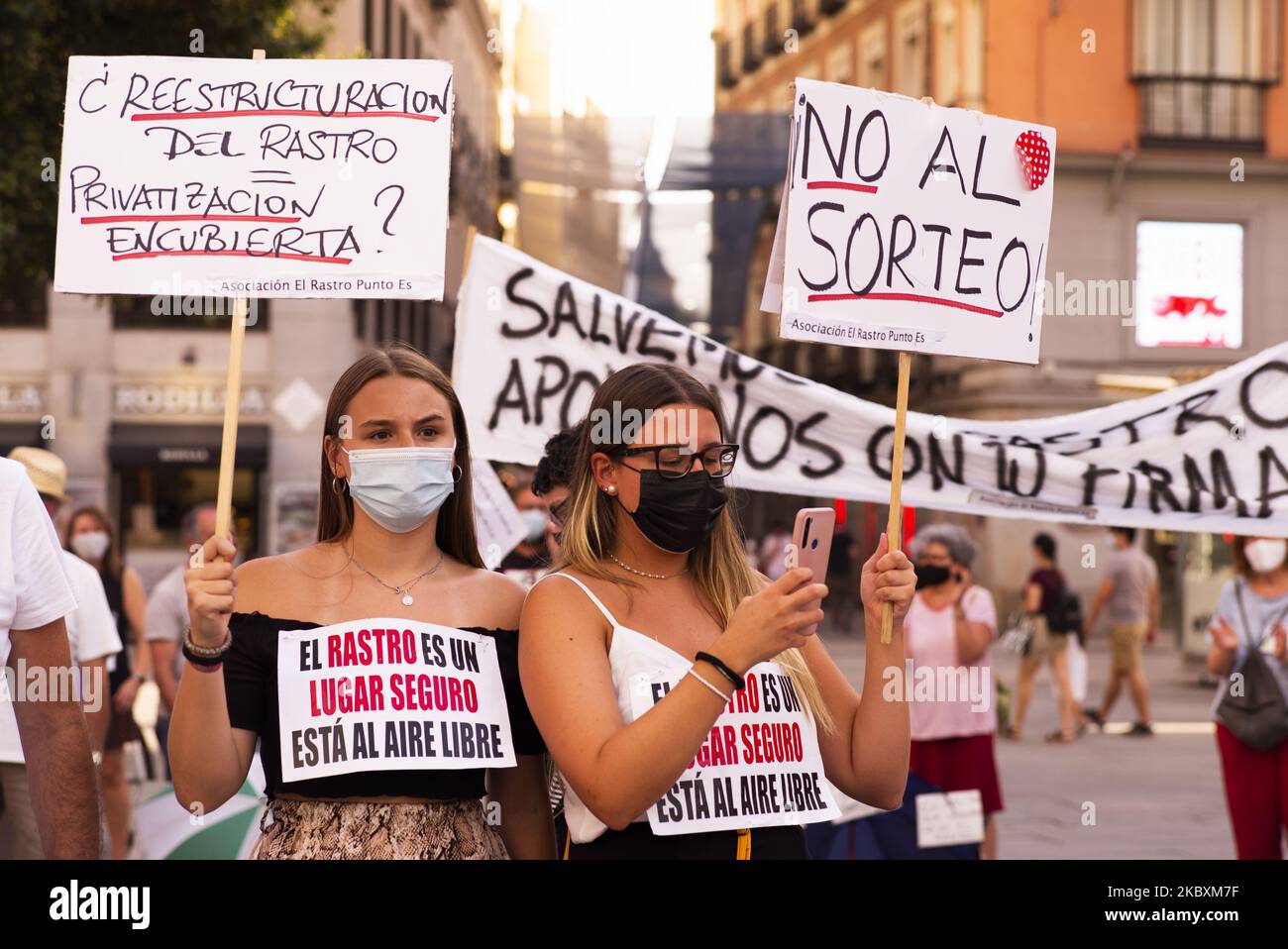 Traders from El Rastro in Madrid hold banners during the demonstration ...
