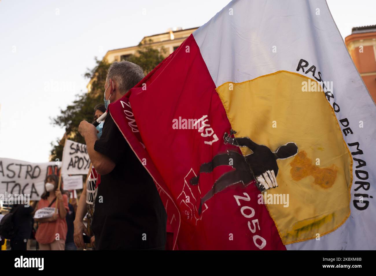 Traders from El Rastro in Madrid hold banners during the demonstration ...