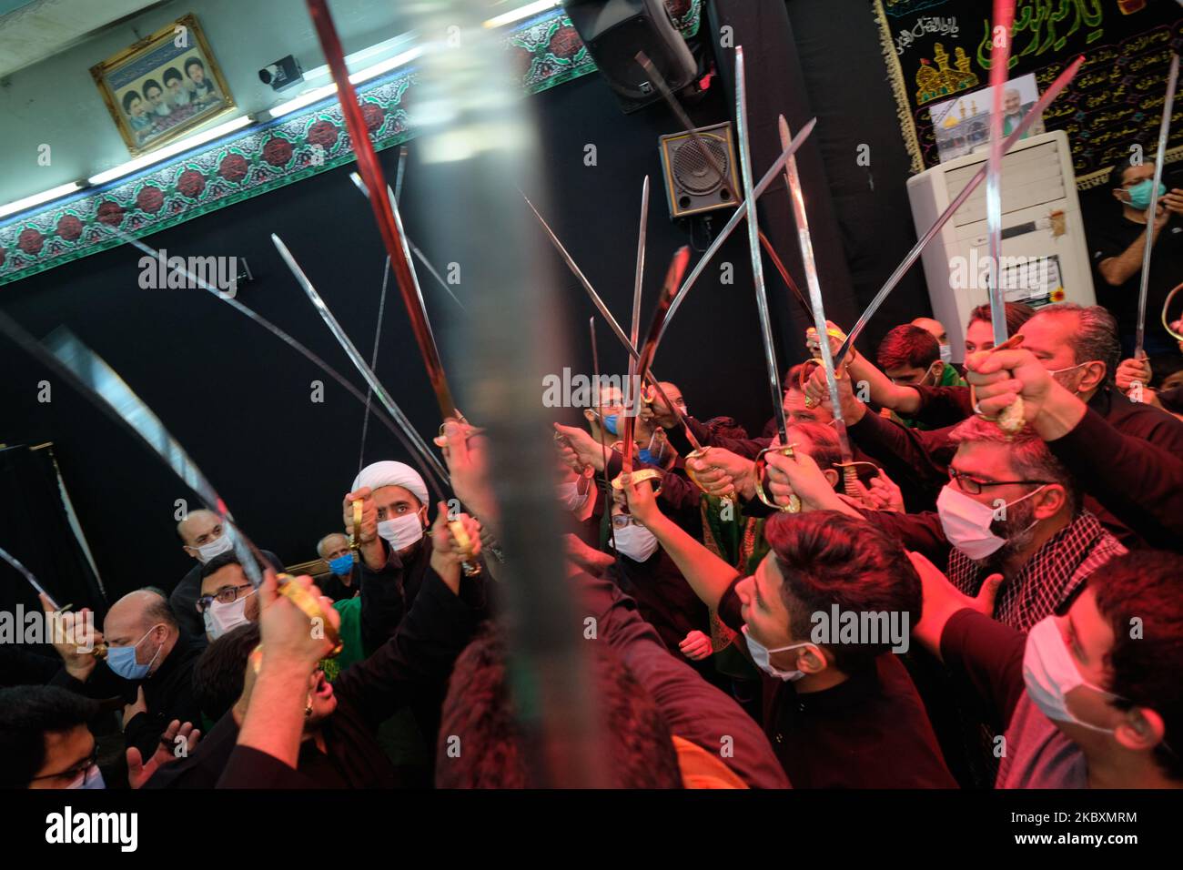 Iraqi immigration men living in Tehran wearing protective face masks ...