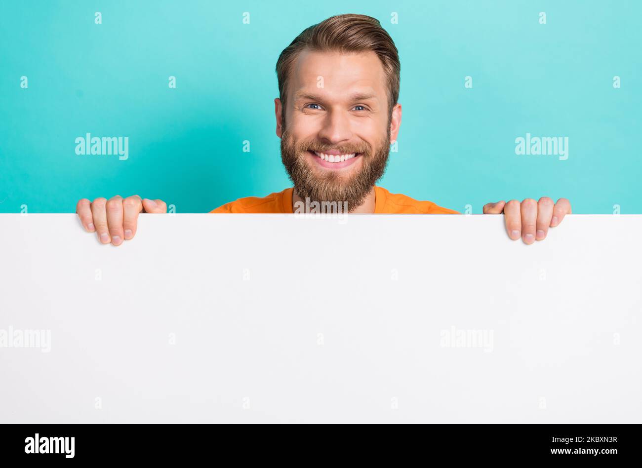 Portrait of positive cheerful handsome guy with blond hairdo wear ...