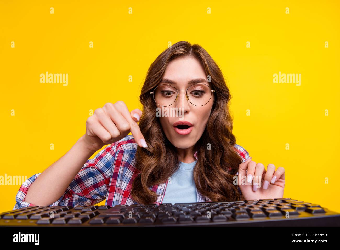 Portrait of cute girlish positive woman curly hairstyle checkered shirt ...