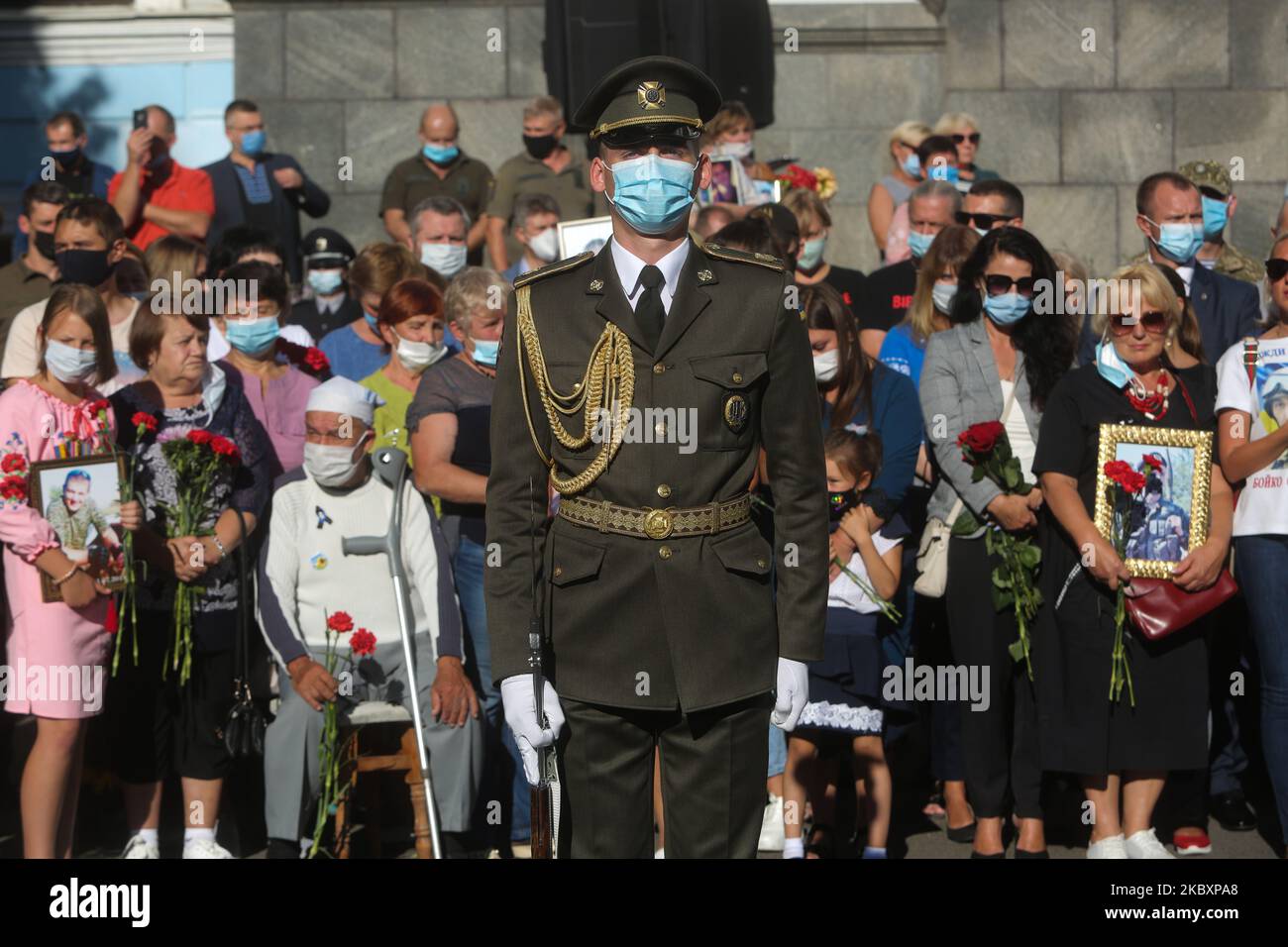 Honor Guard soldier stand next to fallen heroes families during the ...