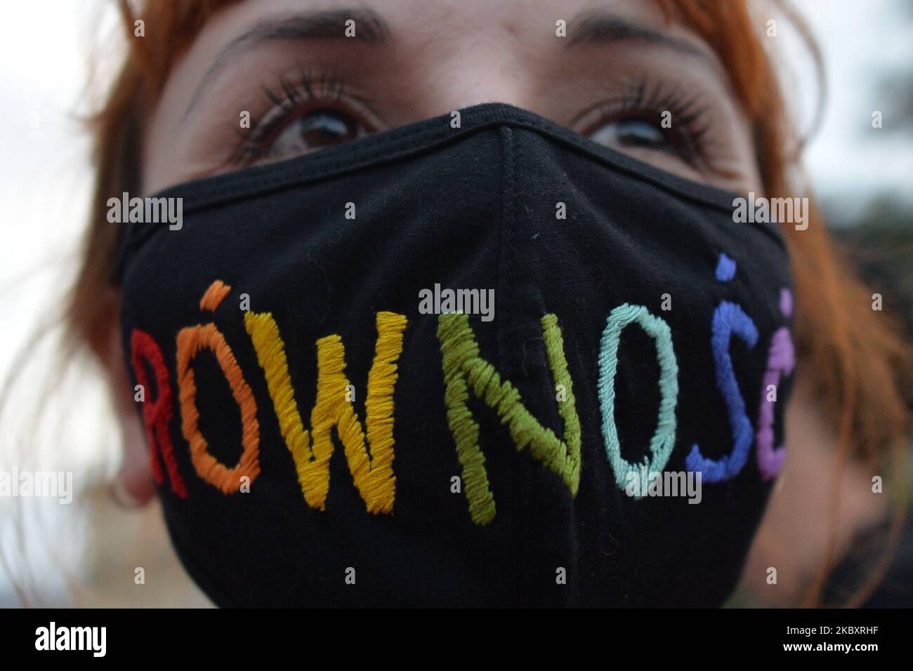 A Pro-LGBT activist wears a protective mask with an the 'Equality ...