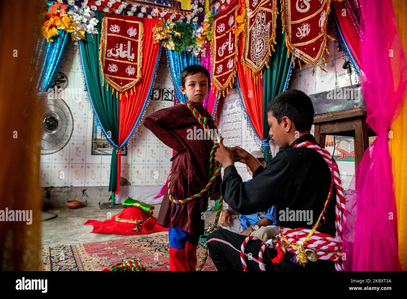 A young bihari wears his traditional ashura attire inside the geneva ...