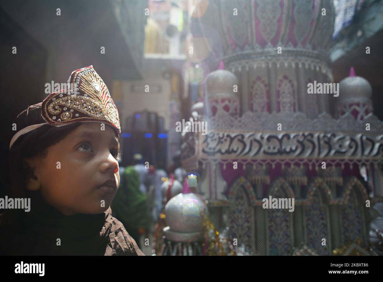 A girl wearing a crown visiting Tajia in the occasion of Asura in Dhaka ...