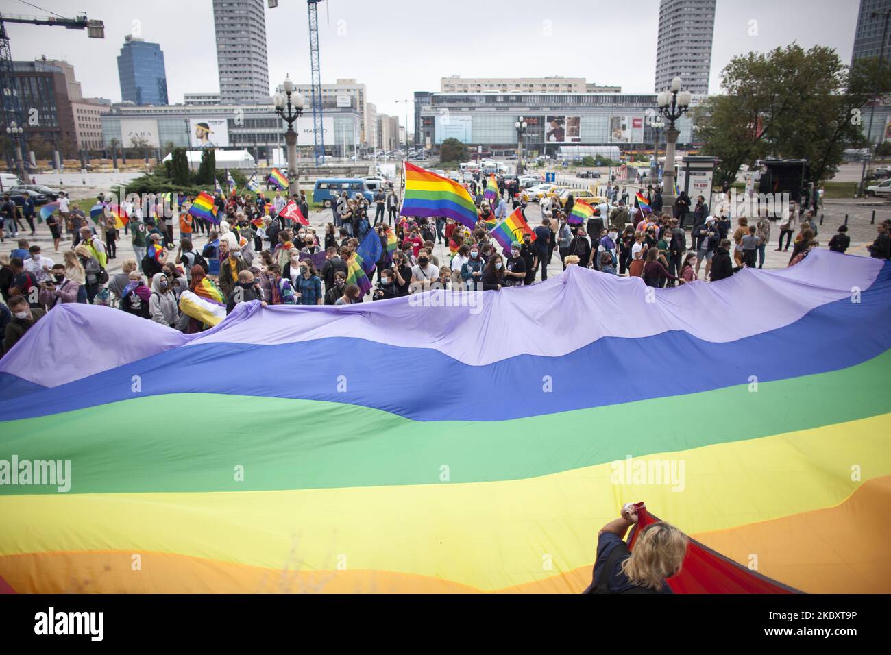 a crowd hold rainbow flag during Stop Violence against LGBT people ...