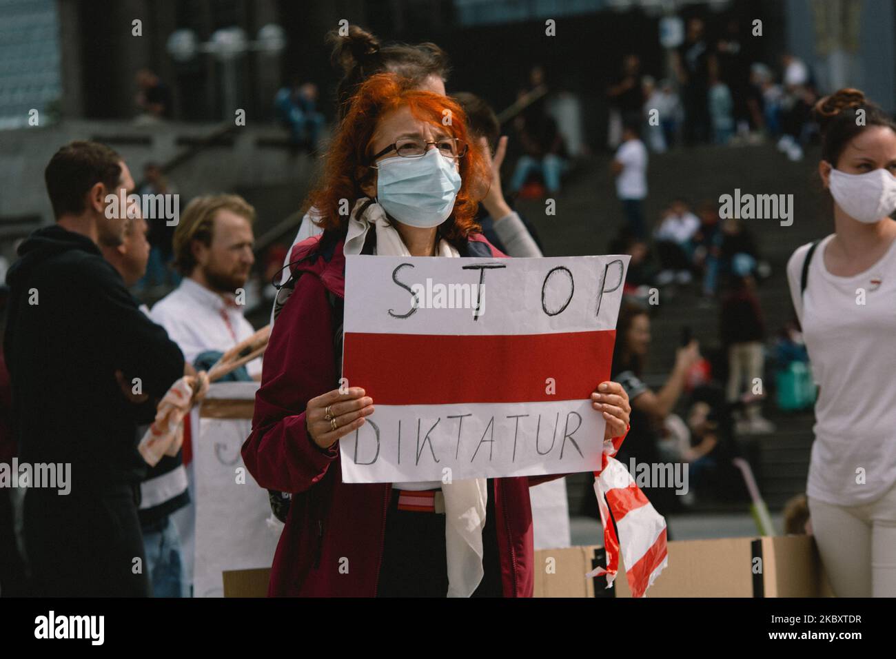 A woman holds sign ''stop dictatorship'' during the protest against ...
