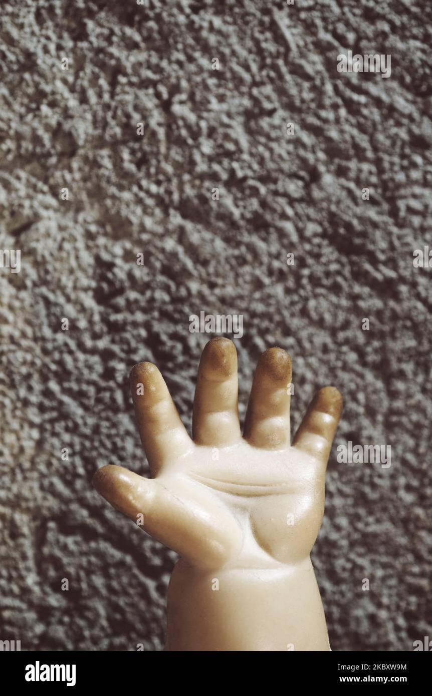 baby doll's arm raised Stock Photo - Alamy