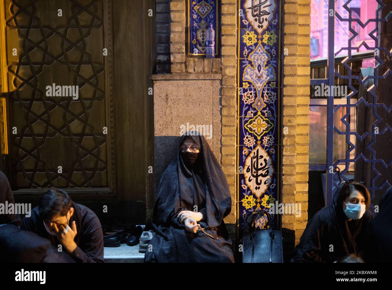 Veiled woman sits mourning hi-res stock photography and images - Alamy