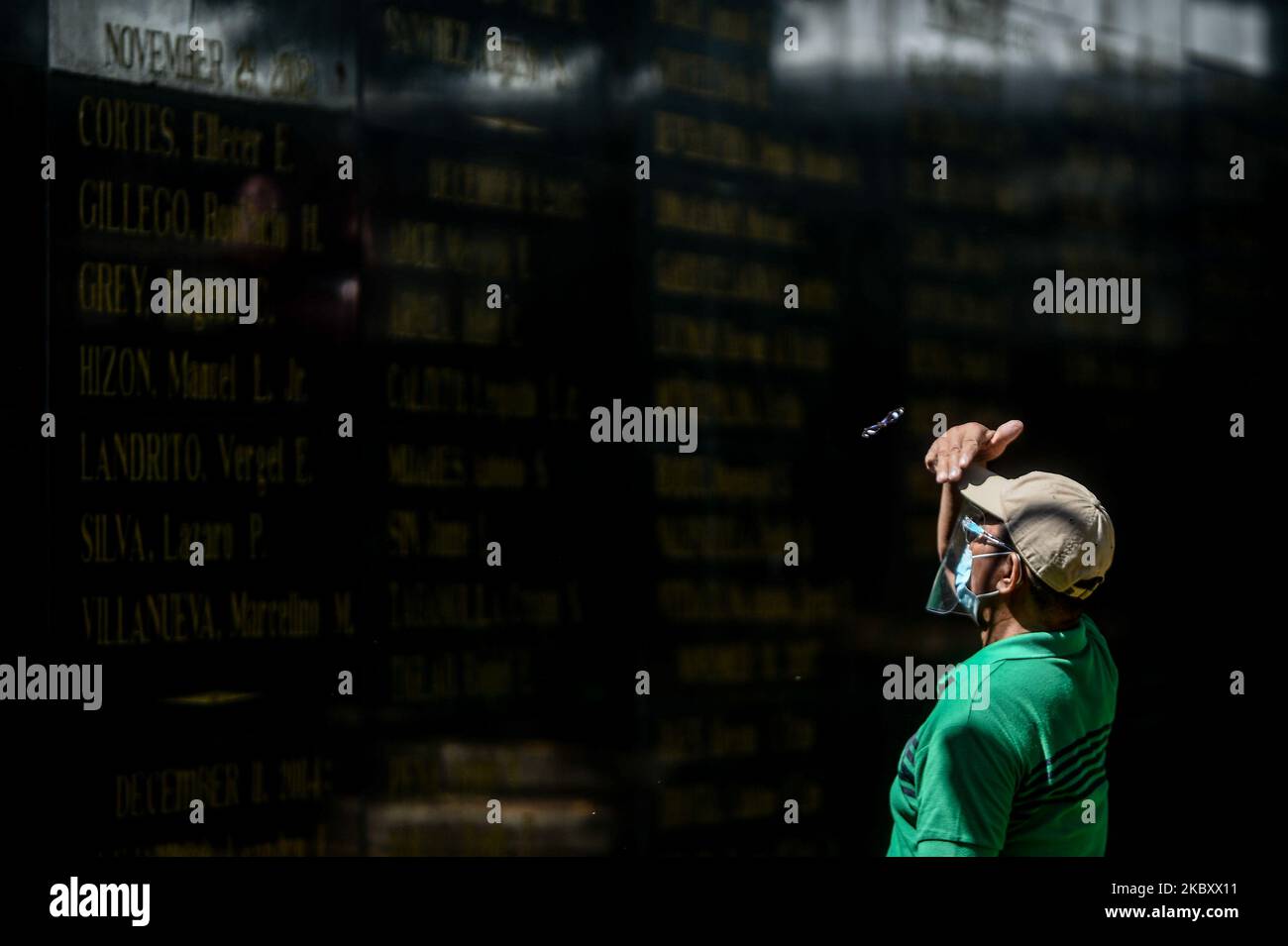 A man looks at the names of the martyrs and heroes who fought the ...