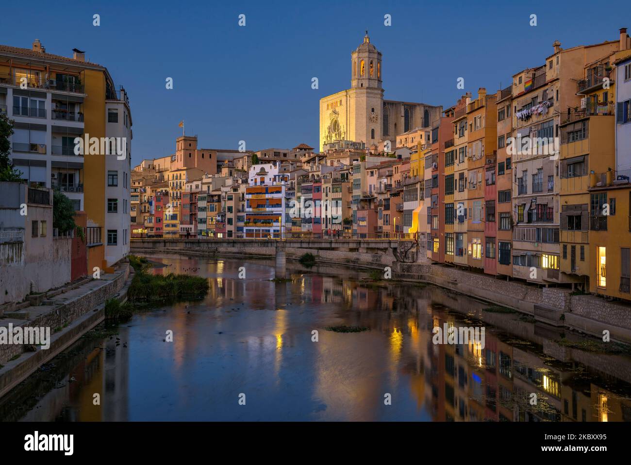 Girona Cathedral and houses next to the Onyar river at twilight (Girona ...