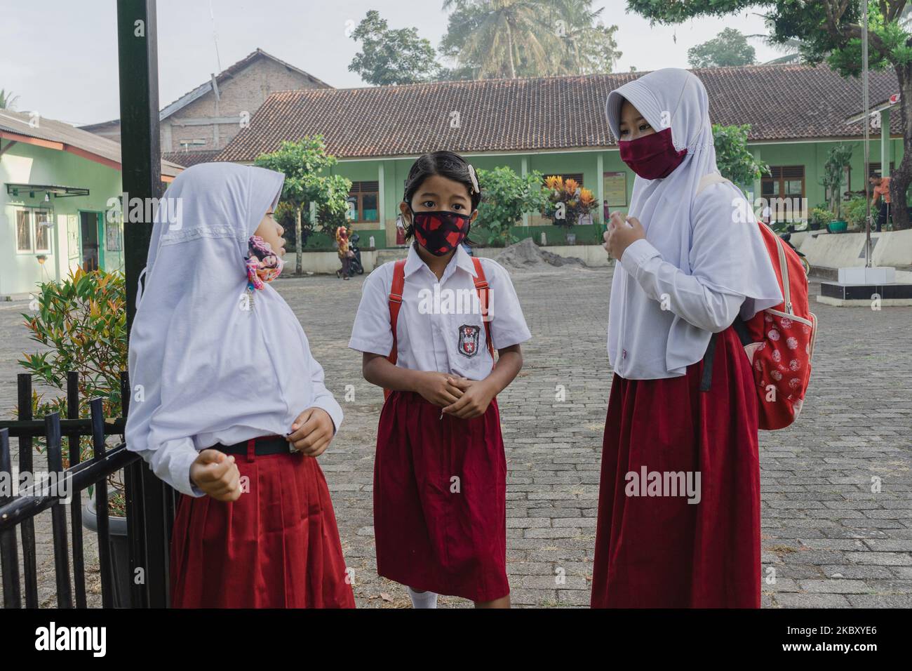 Students gather before entering the classroom at Candirejo Elementary ...