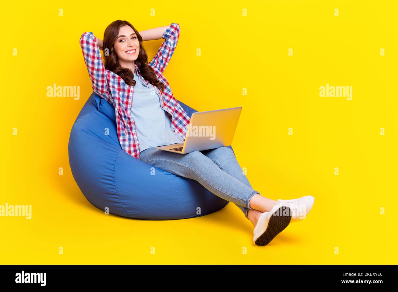 Full length photo of satisfied woman sitting relaxed beanbag nap chill ...