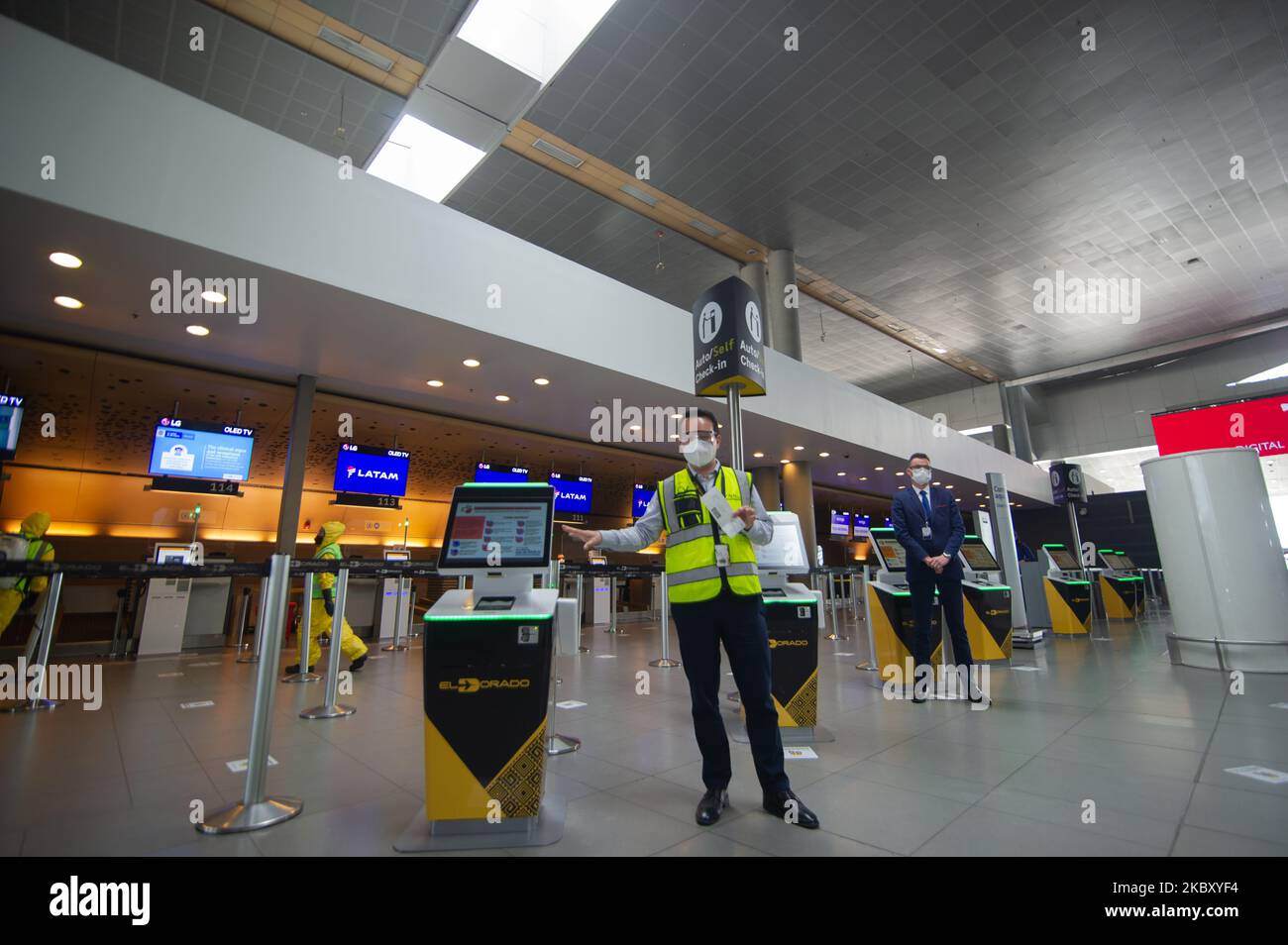 Self check in and baggage registration machines are placed on counters ...