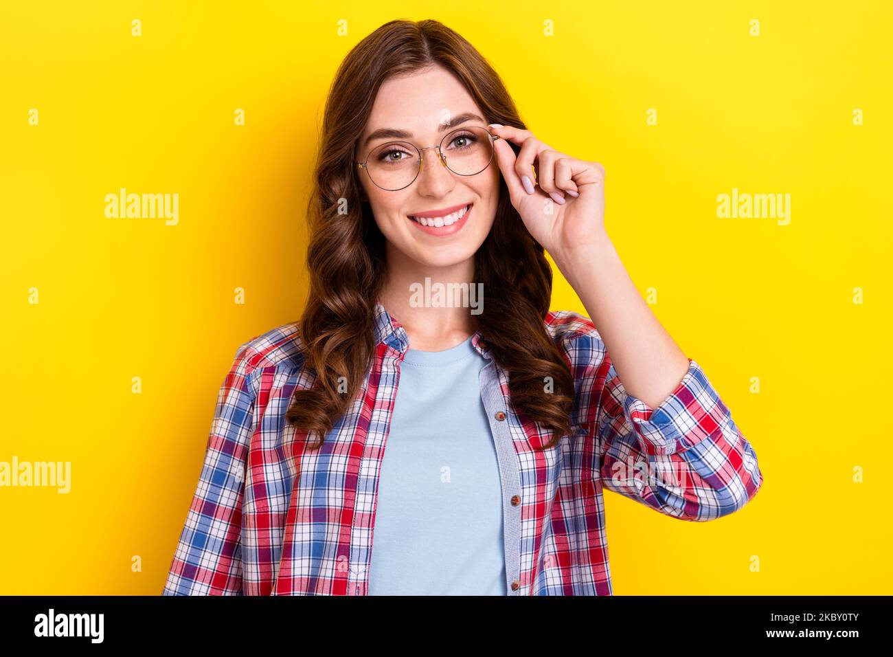 Photo of pretty shiny young girl dressed checkered shirt arm eyewear ...