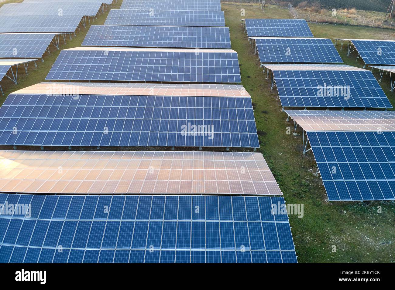 Aerial view of large sustainable electrical power plant with rows of ...