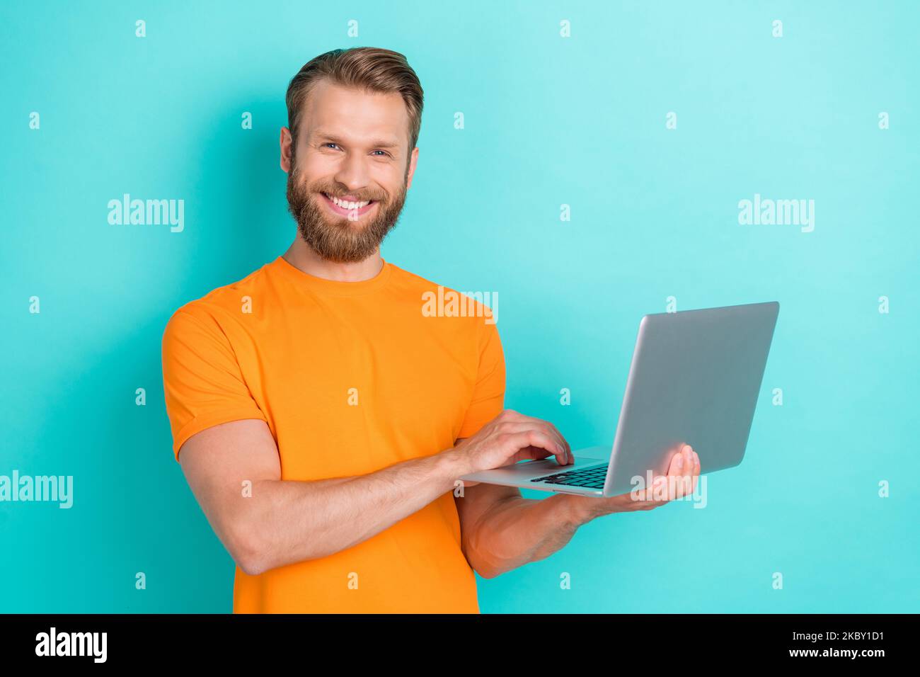 Portrait Of Handsome Positive Glad Guy With Blond Hairdo Wear Orange T