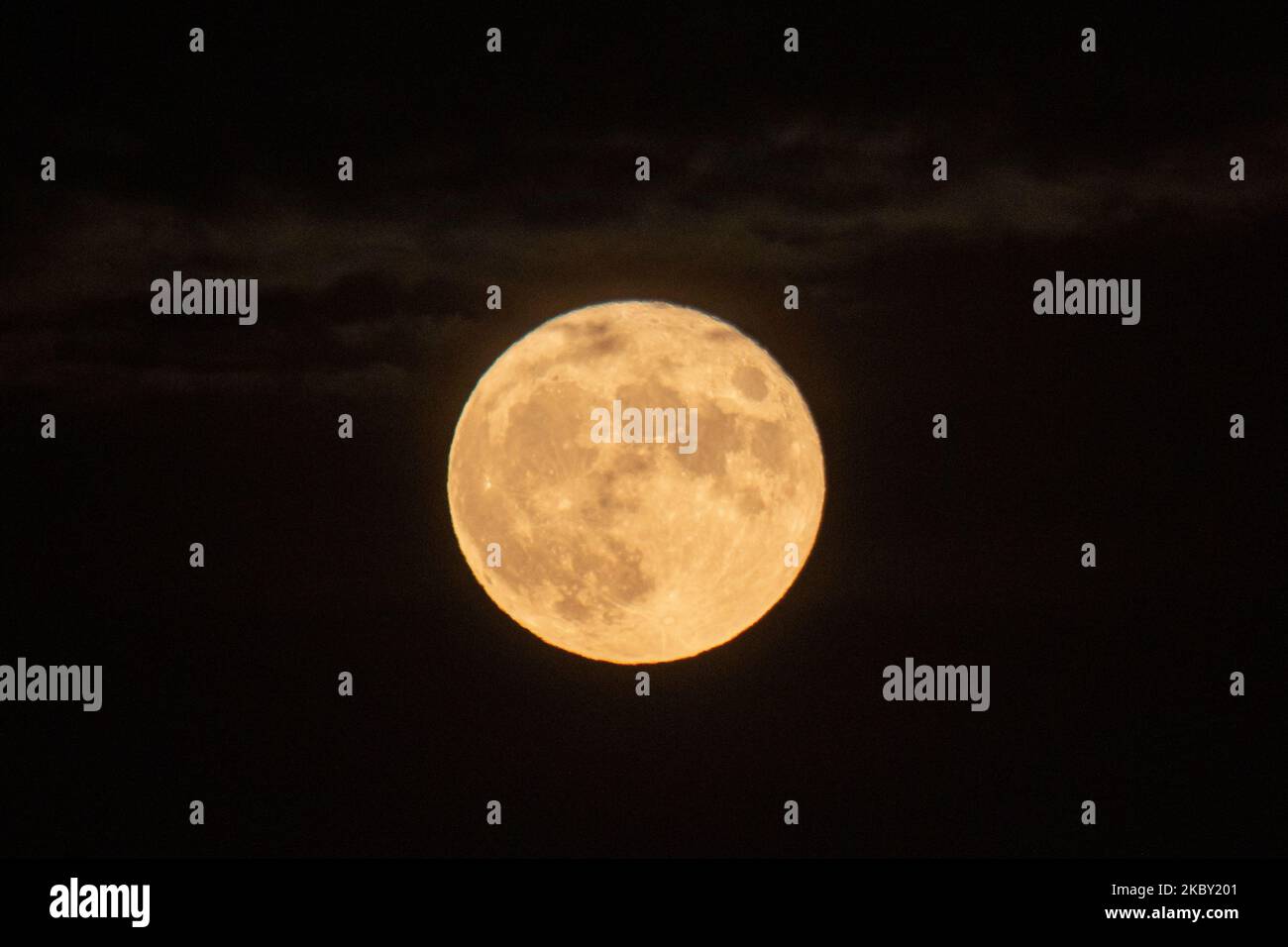 The Full Corn Moon as seen behind Hortiatis mountain over the city of ...