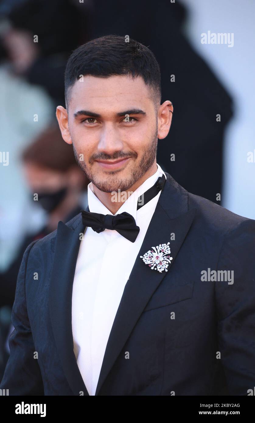 Alejandro Speitzer poses on the red carpet with the Golden Lion ...