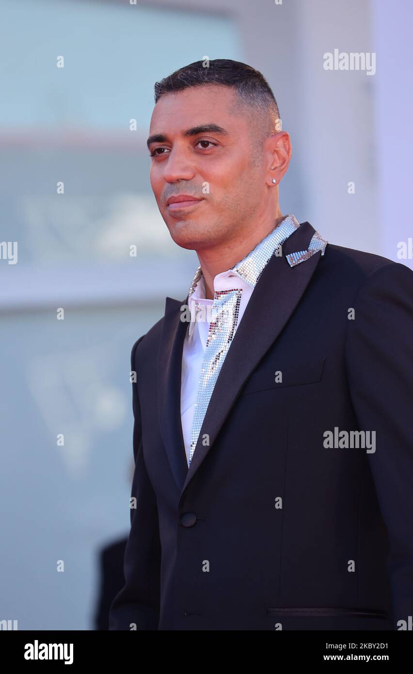 Marracash poses on the red carpet during the 77th Venice Film Festival ...