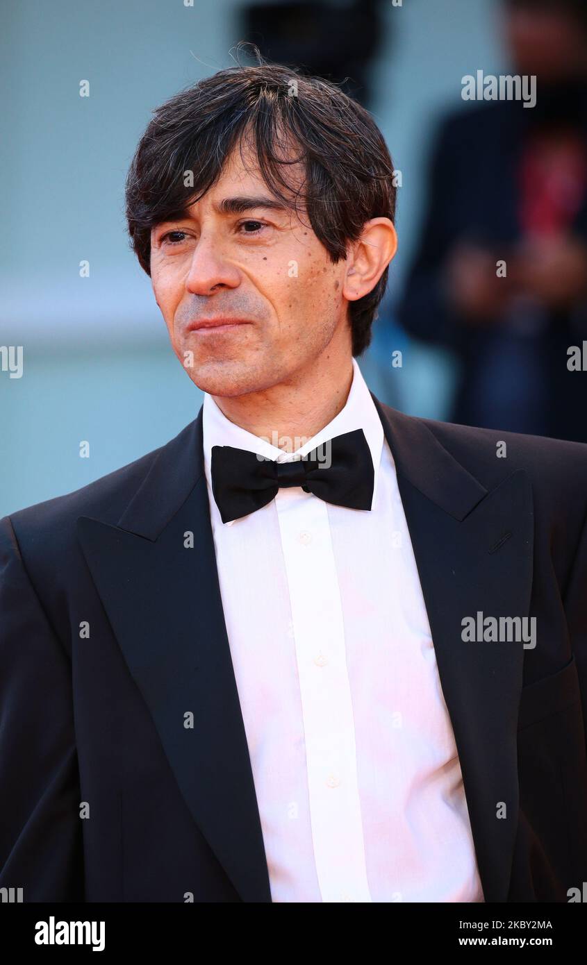 Luigi Lo Cascio poses on the red carpet during the 77th Venice Film ...